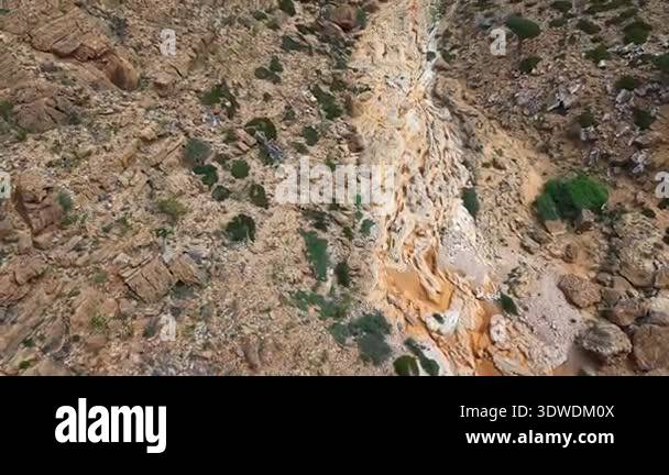 Aerial view of rugged rocky hillside with an eroded limestone ravine or ...