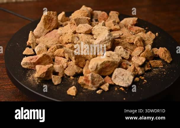 Side View of Multani Mitti (Fullers Earth) Rotating on Black Background ...