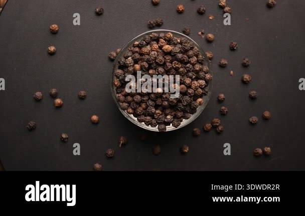 Top View of Black Pepper Seeds (Kali Mirchi) in Bowl on Black ...