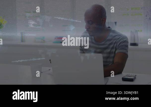 Software developer tapping keyboard and activating holographic map code ...