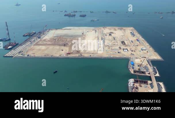Forward aerial view of Sihanoukville port expansion project featuring ...