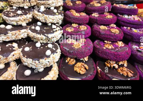 People gather to enjoy various types of sweets made from local ...
