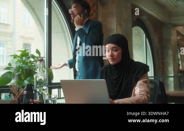 Two multiracial colleagues business team businessman talking phone ...
