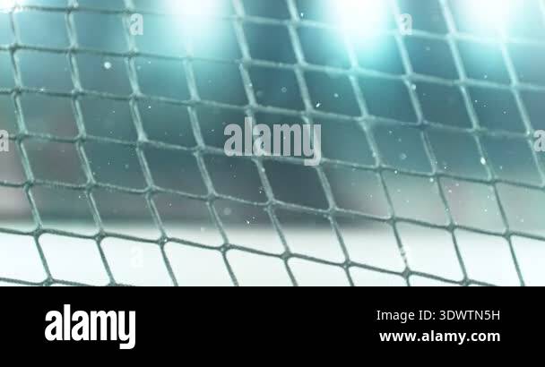 Extreme super slow motion close-up of a hockey goal net with ice ...