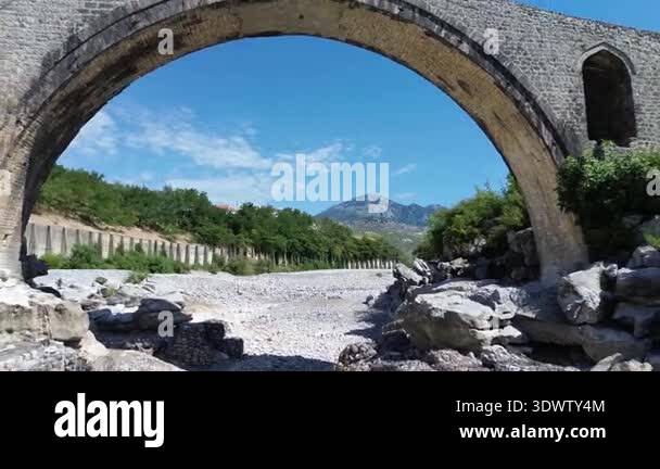 Drone view of stone Mesi Bridge in Skoder, Albania. Aerial perspective ...
