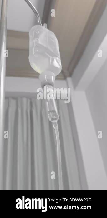 Close Up IV Drip Normal Saline Flow in Hospital Medical Treatment ...