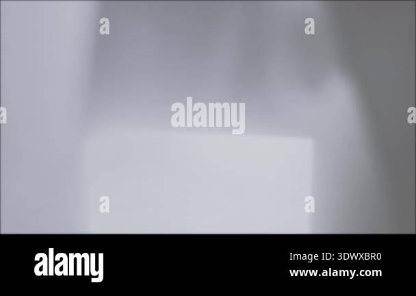 Abstract slow-motion video featuring soft white and gray geometric ...