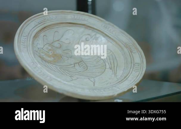 Burnt clay plate with native designs and symbols - a dove, 14th century ...