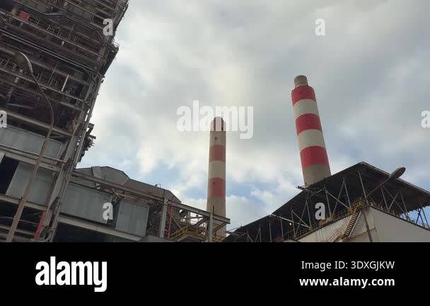 Industrial Power Plant with Towering Red and White Striped Smokestacks ...