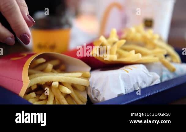 Poznan, Poland - 28 August 2024: Girls Eating Fried Potatoes At A ...