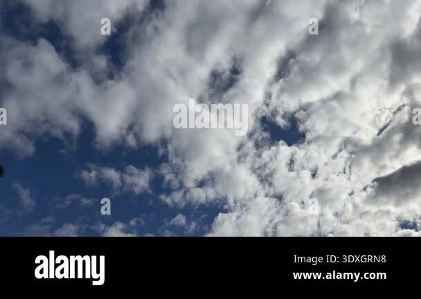 Dramatic clouds form a striking scene, showcasing their dynamic shapes ...