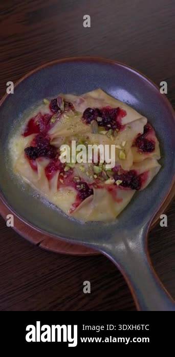 Close up chef of Italian restaurant preparing brie cheese baked in the ...