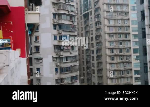 Chongqing, China - December 8, 2025: Elevated urban square atop multi ...