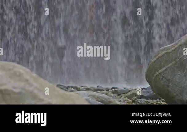 Water falls from man made cascade. Falling water close up. Cascatella ...