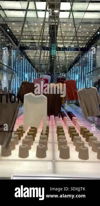 Retail Store Window Display with Sweaters Hanging Like Moving Pendulums ...