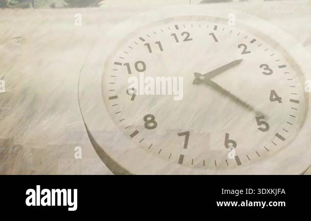 Clock starting after twelve amid windy field with clock hands advancing ...