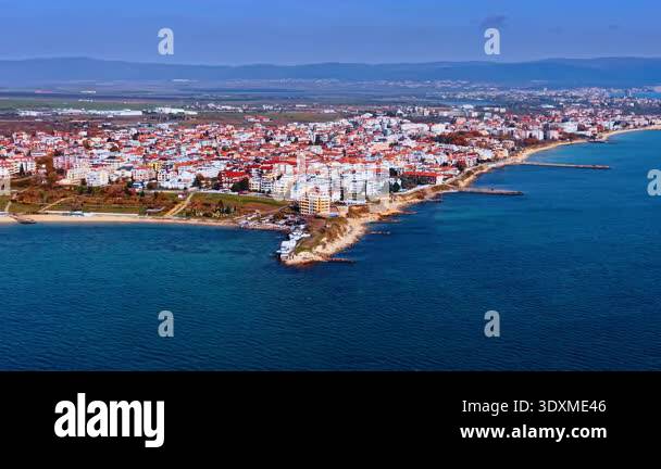 Dense coastal town architecture with piers and blue sea aerial. Aerial ...