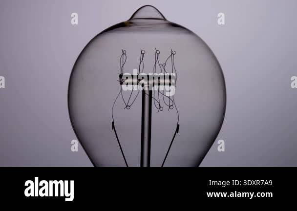 Round clear glass vintage edison bulb with multiple filaments in the ...