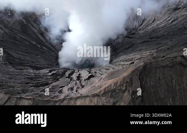 Aerial view of Mount Bromo crater in East Java, Indonesia, with thick ...