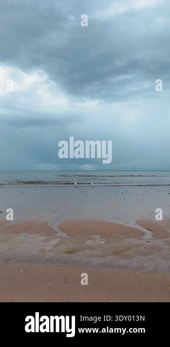 Beach rain clouds, sunset landscape Stock Video Footage - Alamy