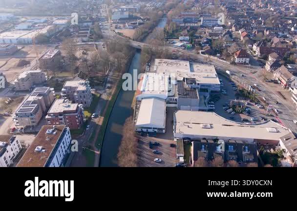 High angle aerial view of a narrow canal flowing through a modern ...