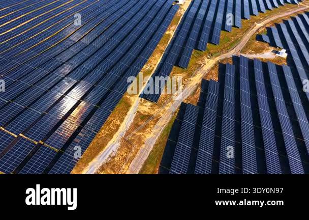 Aerial perspective of solar panels with service roads between rows. Top ...