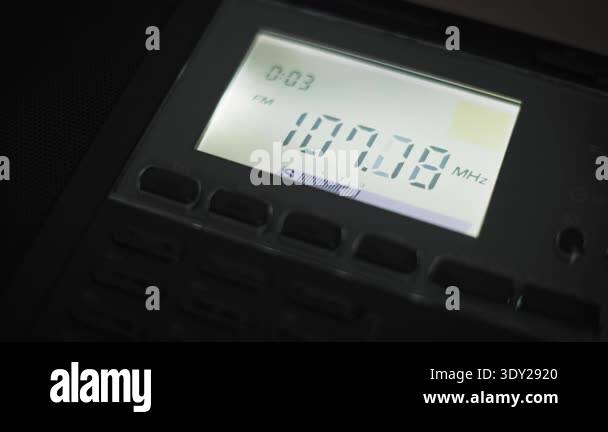 Tilted angle of a radio tuner backlit LCD display scanning down through ...