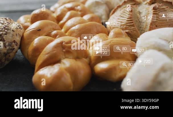 At second mark camera panning over bread array with icons rising and ...
