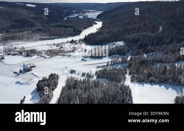 Panoramic aerial view from the base of the snow-covered Mont-Castor ski ...