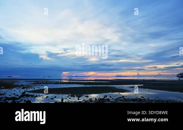 Time lapse of shoreline with dramatic sky during sunset. Fast motion ...