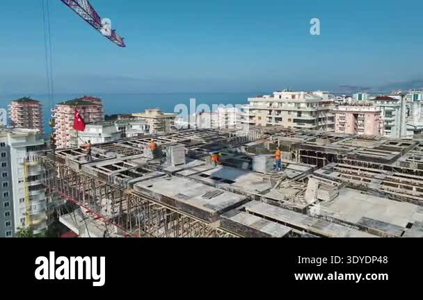 High-rise construction progress filmed from above: slabs, crane ...