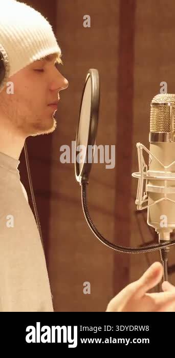 VERTICAL VIDEO: Young Musician Gestures Emotionally Singing Into ...