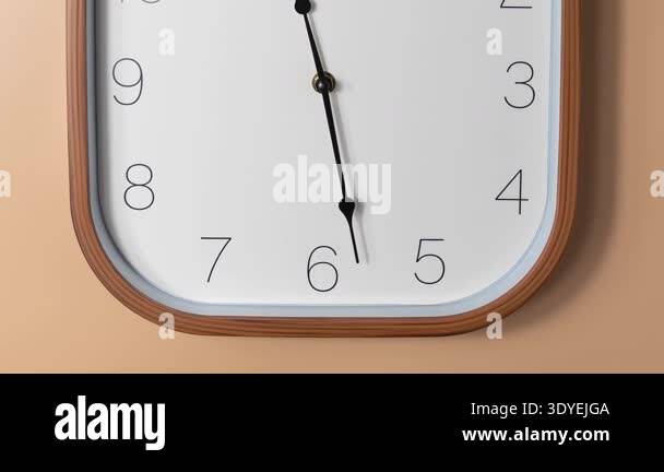 Macro timelapse of a minimalist wall clock. The camera slowly travels ...