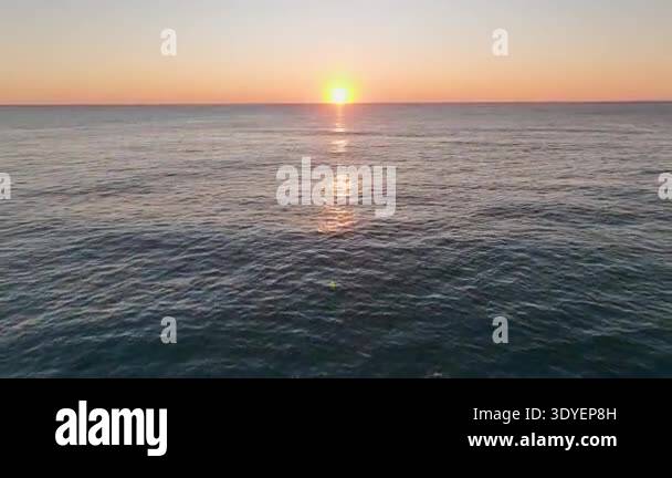 Drone films seashore in golden light Stock Video Footage - Alamy
