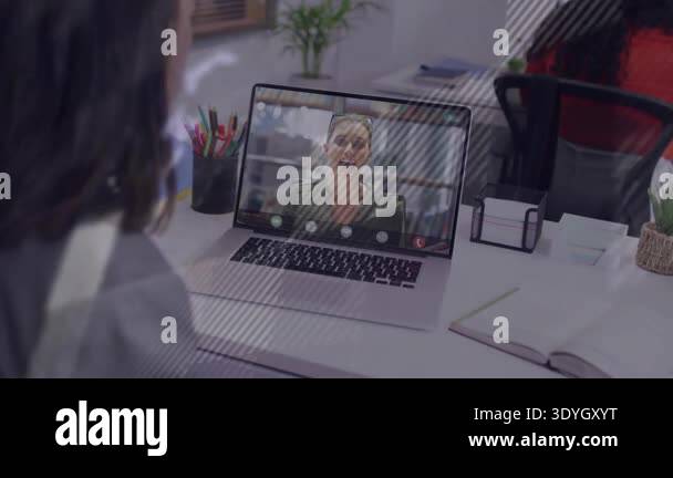 Woman viewing laptop while remote colleague talking initiating diagonal ...