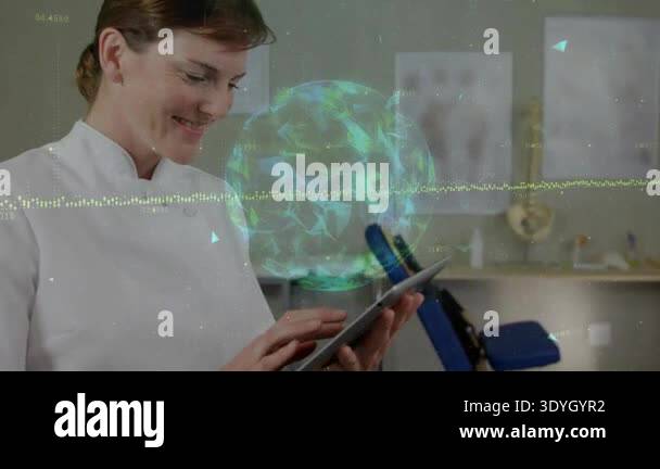 Female clinician tapping tablet and summoning globe with waveform while ...