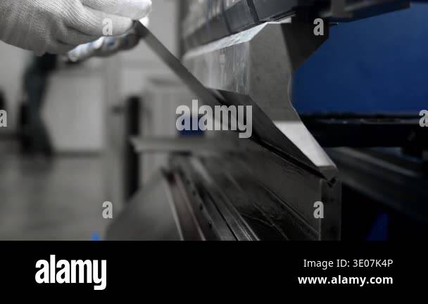 Press brake machine bending metal sheet during sheet metal fabrication ...