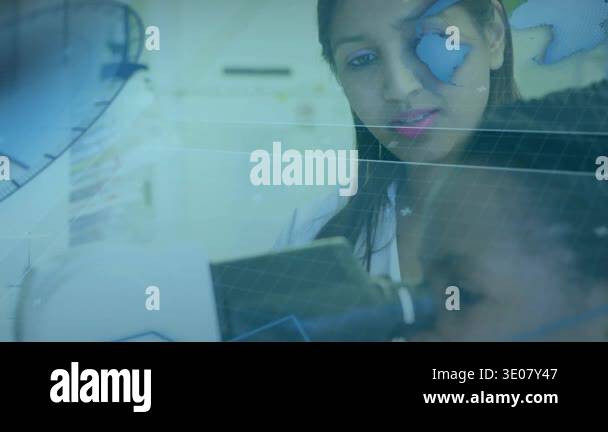 Clinician guiding, patient aligning eye with eyepiece for eye exam ...
