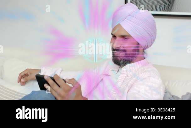 Man sitting on sofa tapping phone, starting tech visuals showing app ...