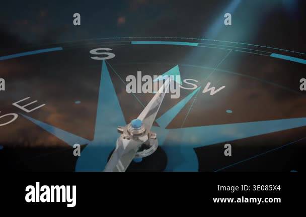 Faint light beam crossing compass face, compass needle rotating ...