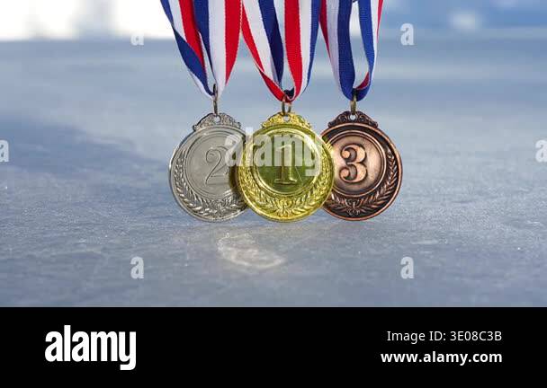 real Gold, silver and bronze medals in the large, illuminated winter ...