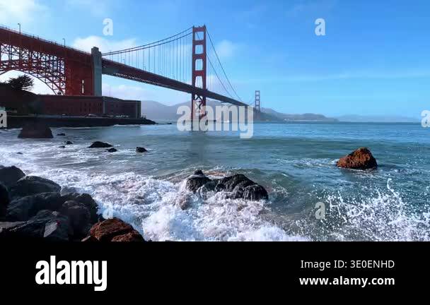 Strong ocean waves crashing against rocks near Golden Gate Bridge ...