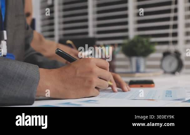 Close up view of businesspeople or accountant team working on financial ...