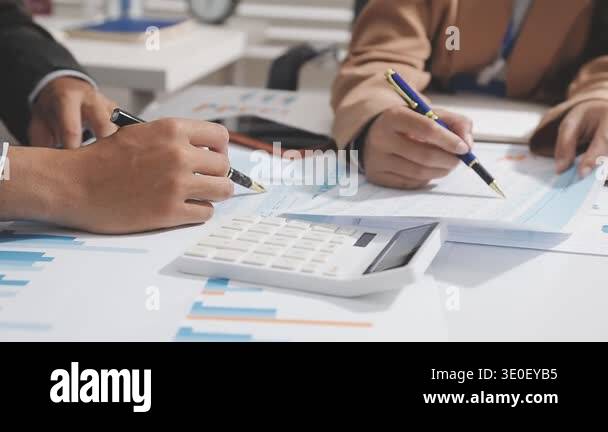Close up view of businesspeople or accountant team working on financial ...