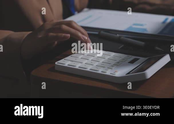 Close up view of businesspeople or accountant team working on financial ...