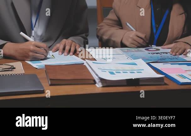 Close up view of businesspeople or accountant team working on financial ...