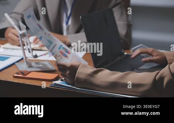 Close up view of businesspeople or accountant team working on financial ...