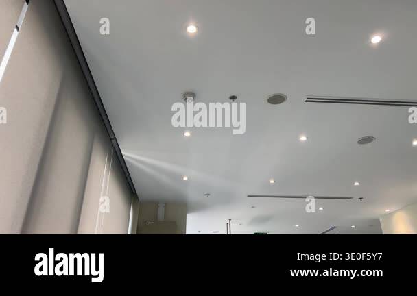 Modern office interior showcasing clean white ceiling with recessed ...