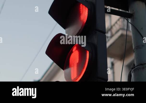 Switching from red to green on a street traffic light. Permission for a ...