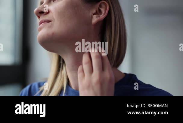 Young woman scratches itchy chest and neck with red rash. Causes of ...